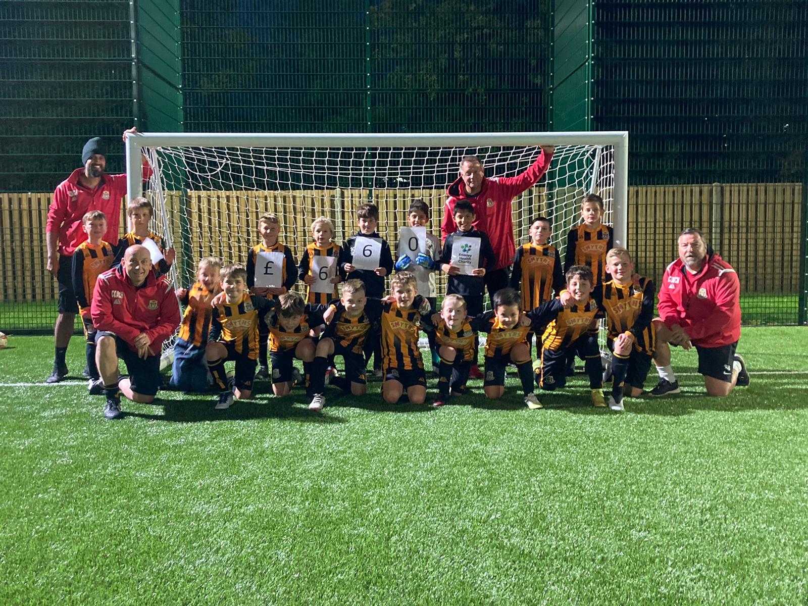 Local junior football team score with a £660 donation - Frimley Health ...